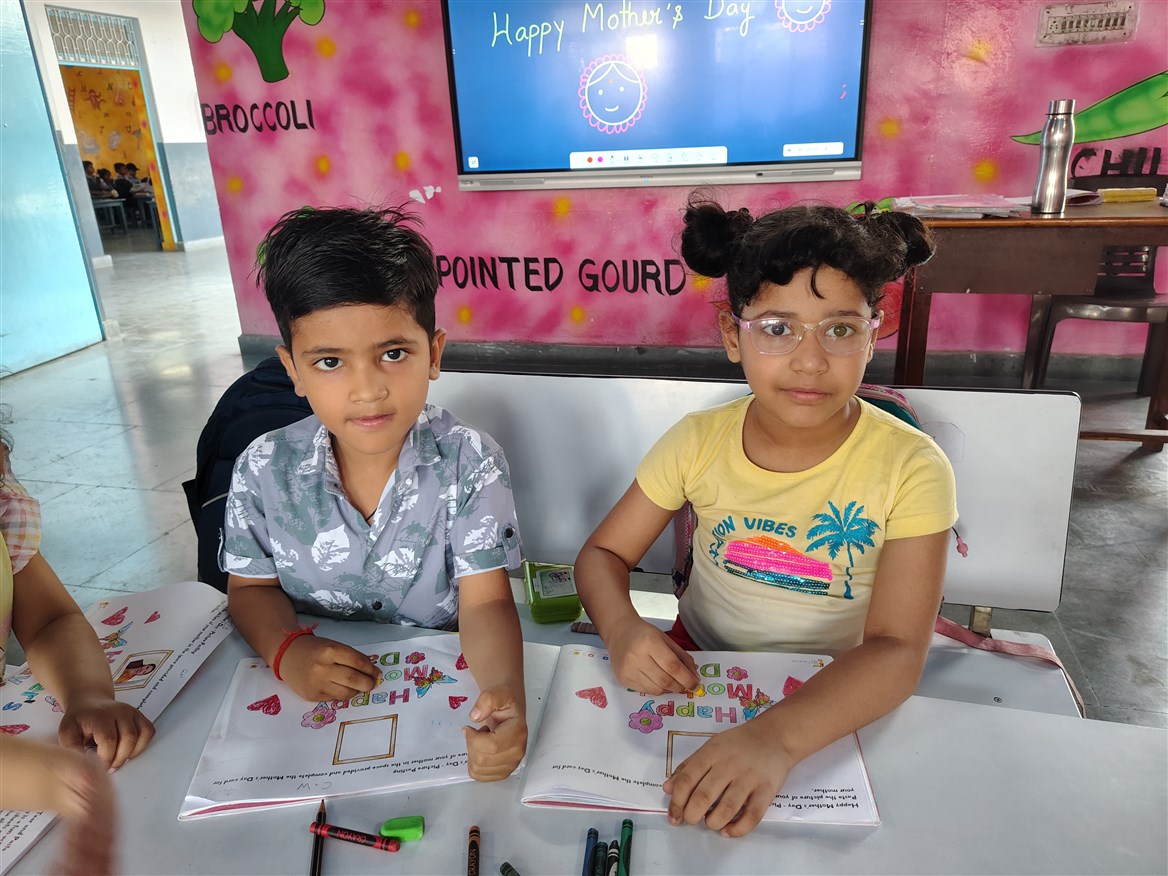 Pasting sequins activity by class UKG Daisy