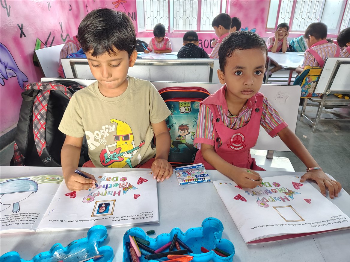 Pasting sequins activity by class UKG Daisy